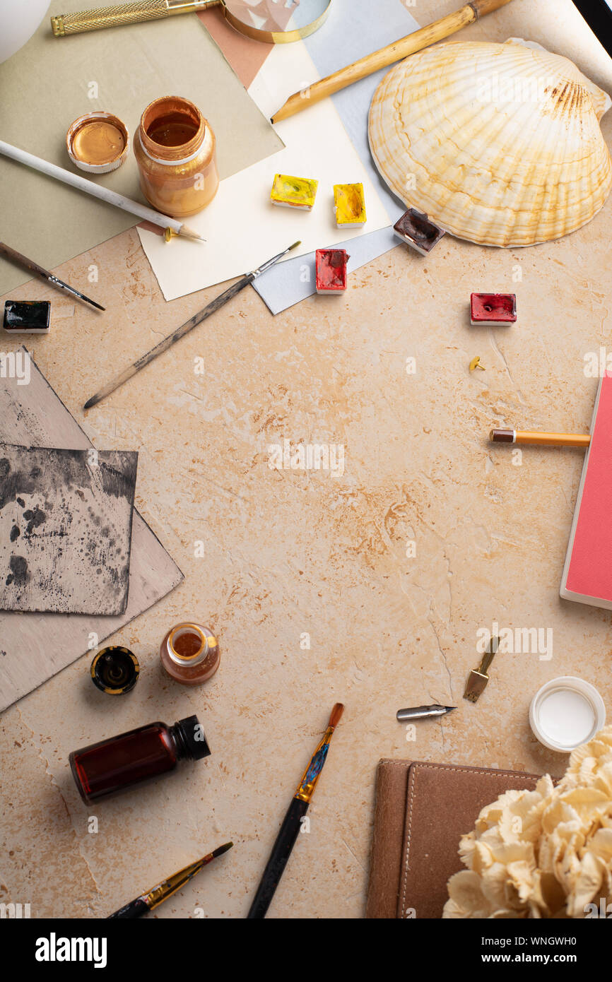 Artist's workspace flatlay. Art equipment on rustic background ...
