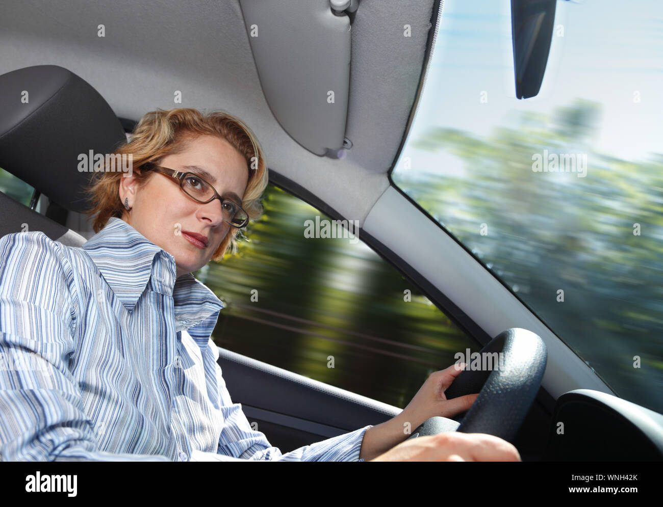 Car mature woman driving hi-res stock photography and images - Alamy