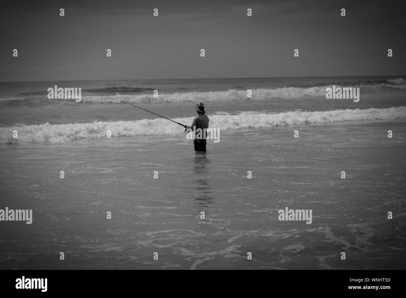 Man fishing in sea dusk activity hi-res stock photography and images ...