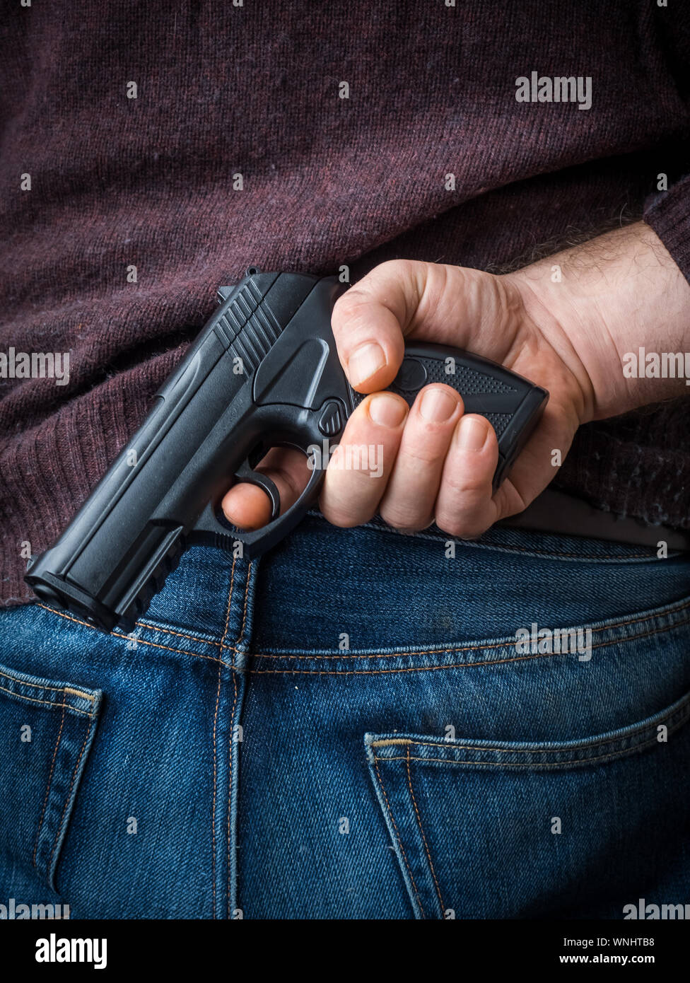 Hand holding toy gun hi-res stock photography and images - Alamy