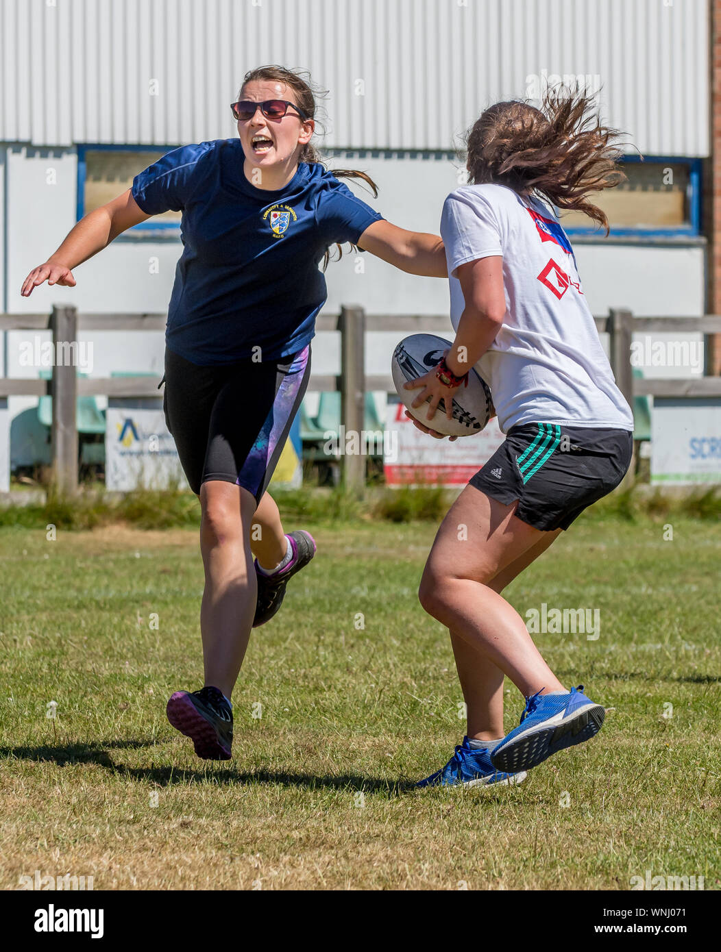 Amateur rugby touch player (male, 20-30 y) evades touch tackle Stock ...