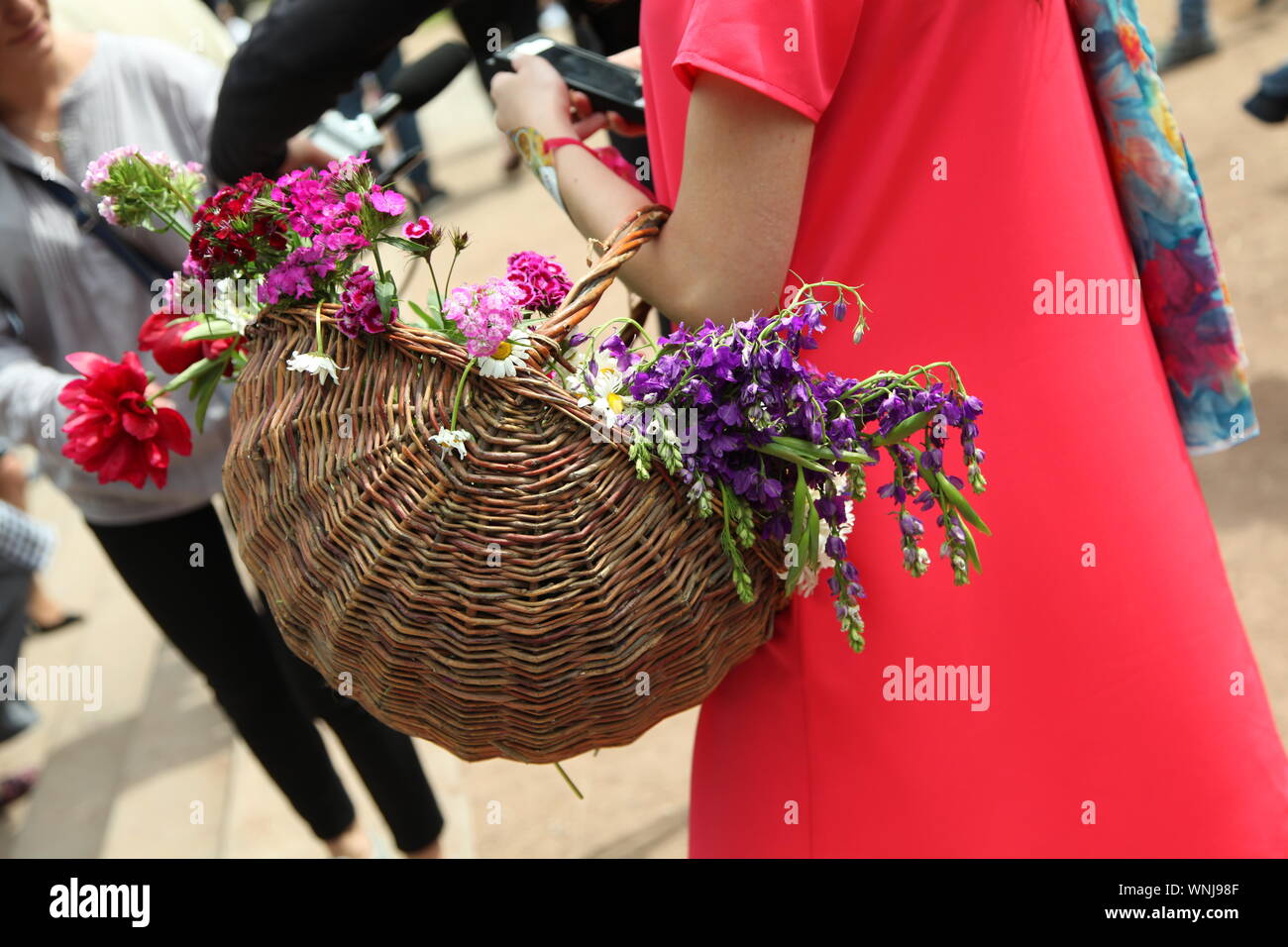 Woman carrying bouquet hi-res stock photography and images - Alamy