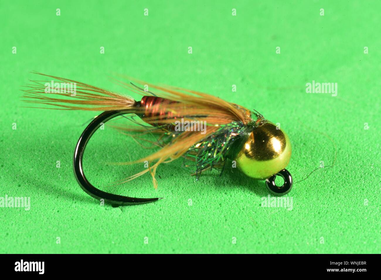 Copper John trout fly Stock Photo - Alamy