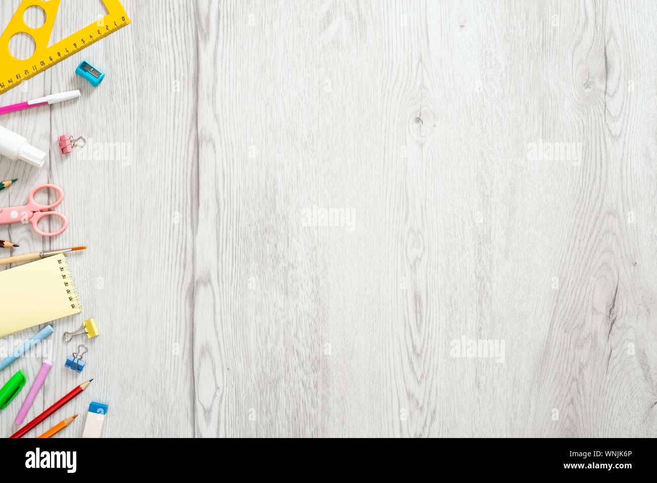 School stationery on wooden background. Back to school creative layout ...