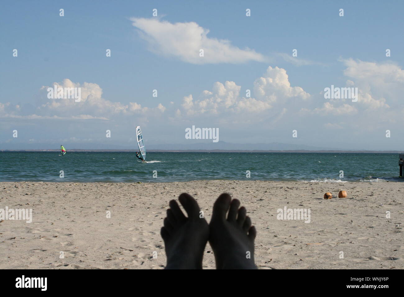 Person relaxing on the beach hi-res stock photography and images - Alamy