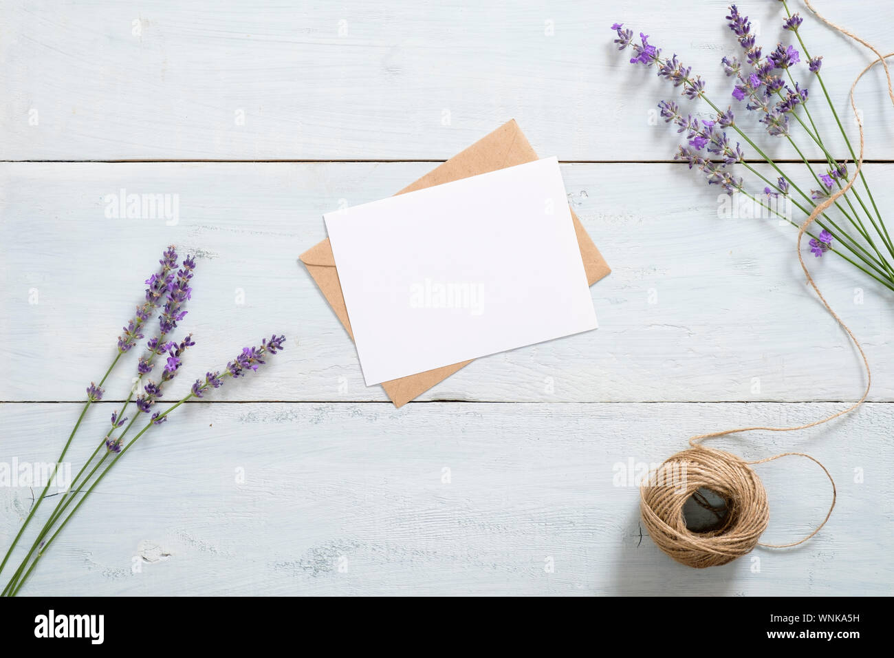 Vintage envelope, blank paper card, lavender flowers and twine on ...