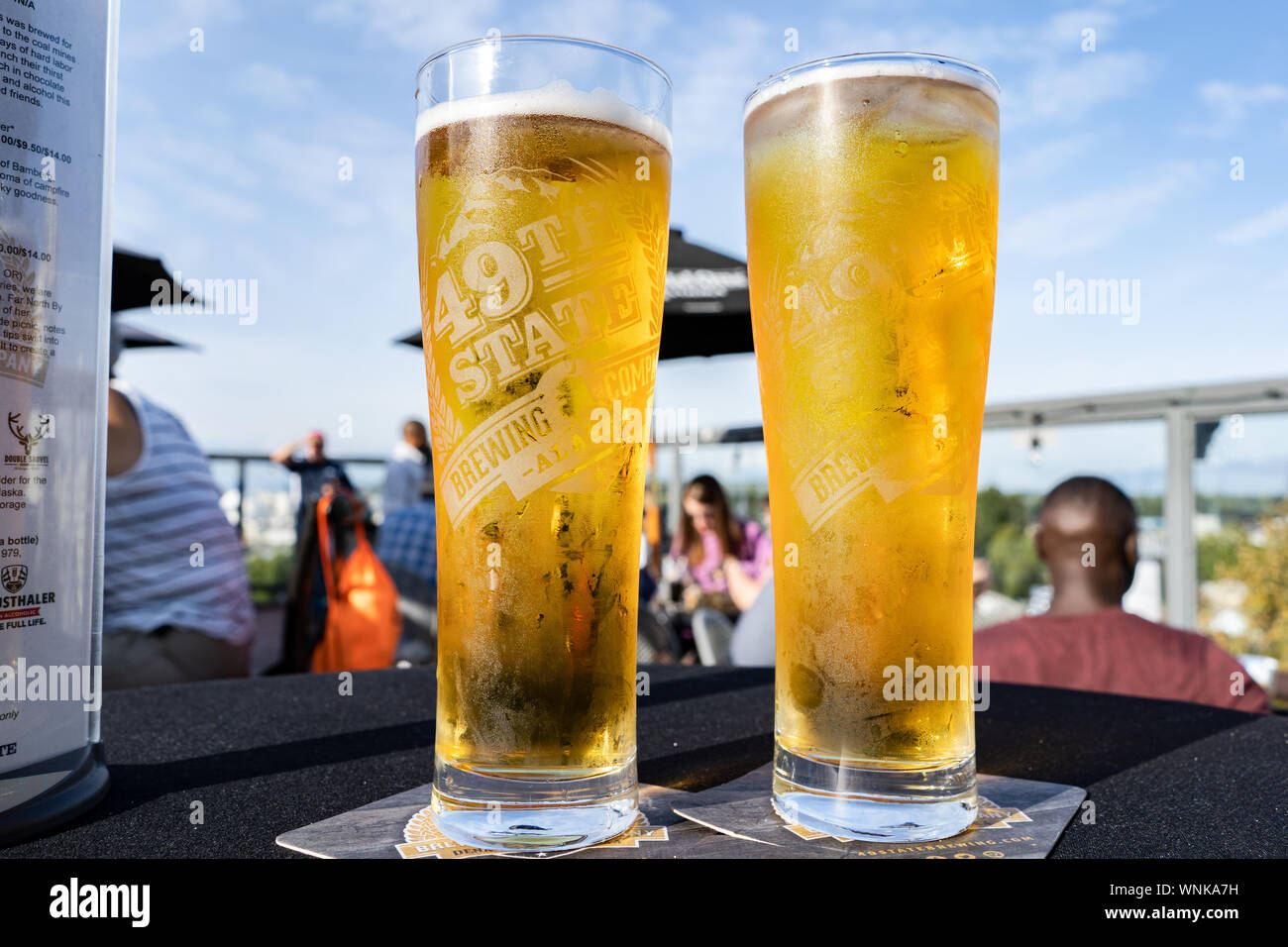 Cold beers at sunny rooftop bar Stock Photo - Alamy