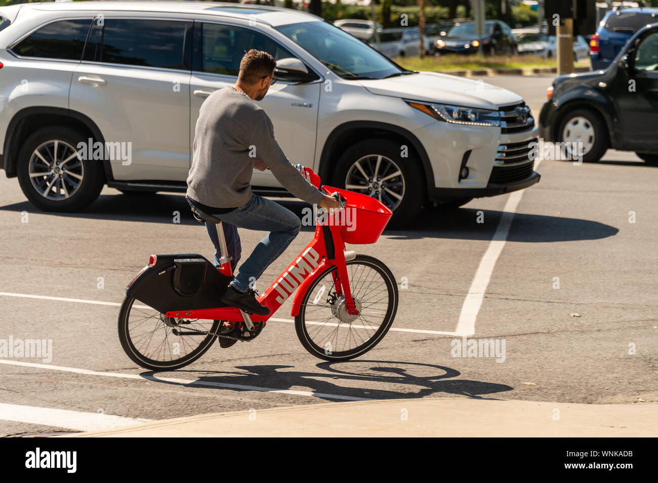 Montreal, CA - 5 September 2019: Man riding a Jump electric bike Stock ...