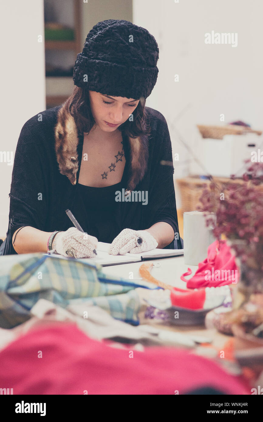 Young woman writing in diary hi-res stock photography and images - Alamy