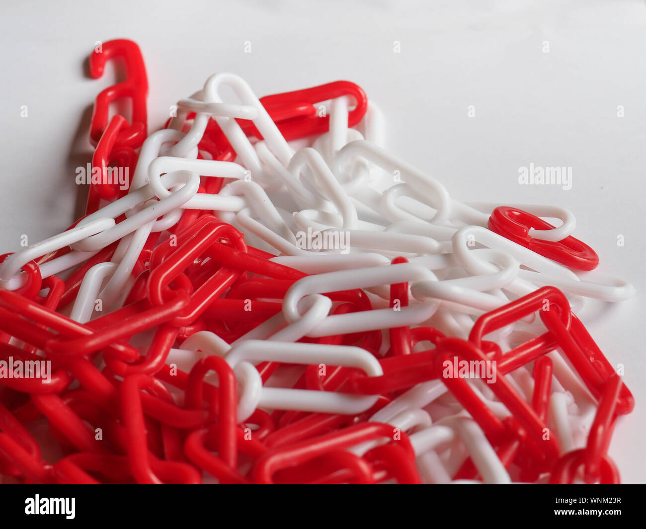plastic red and white warning chain links Stock Photo - Alamy