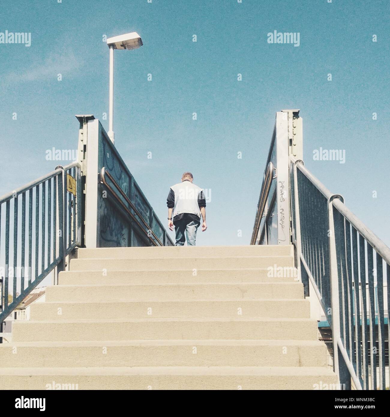 Man walking up hi-res stock photography and images - Alamy