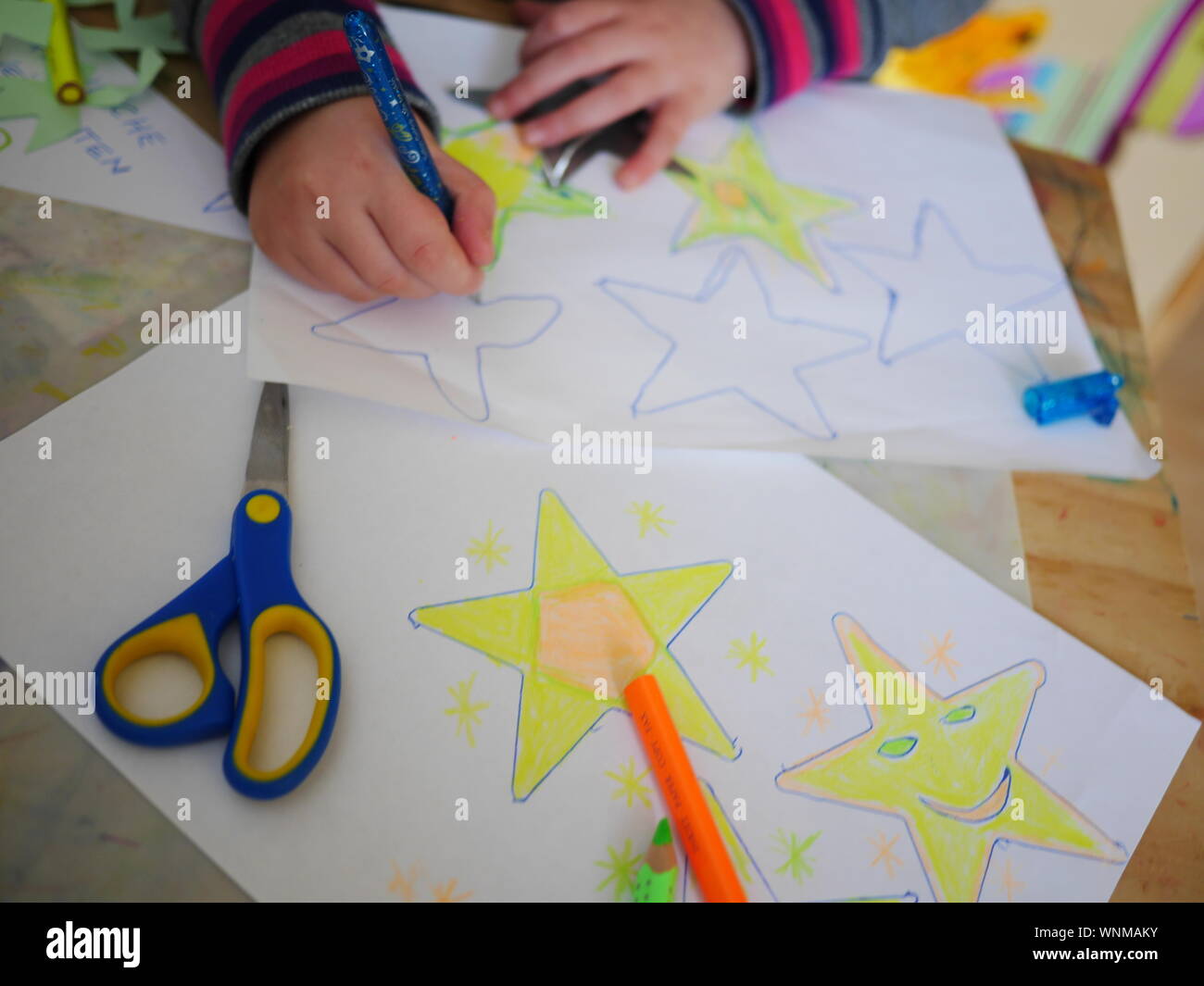Child hand drawing on paper hi-res stock photography and images - Alamy