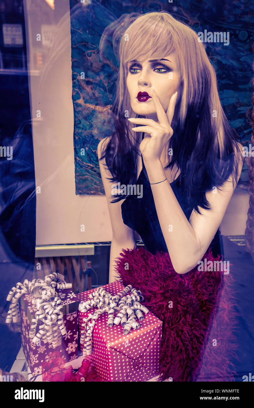 Cool and stylish looking female mannequin in a store window Stock Photo ...