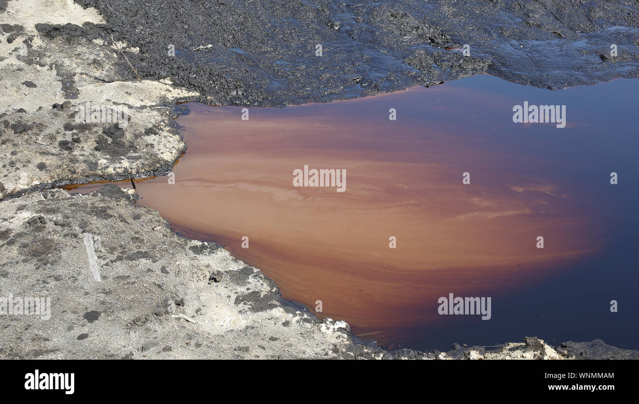Contamination water and soil spot oil pollutions, former dump toxic ...