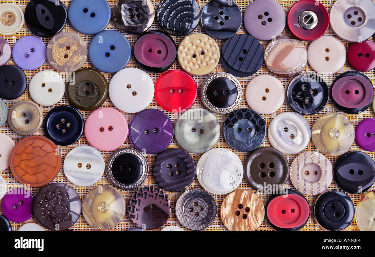 Background of buttons for clothes. Buttons of different shapes and ...