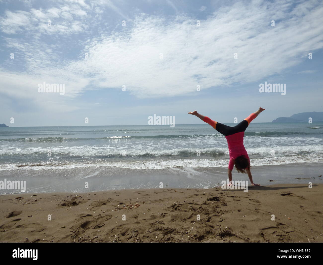 Woman handstand beach sand hi-res stock photography and images - Alamy