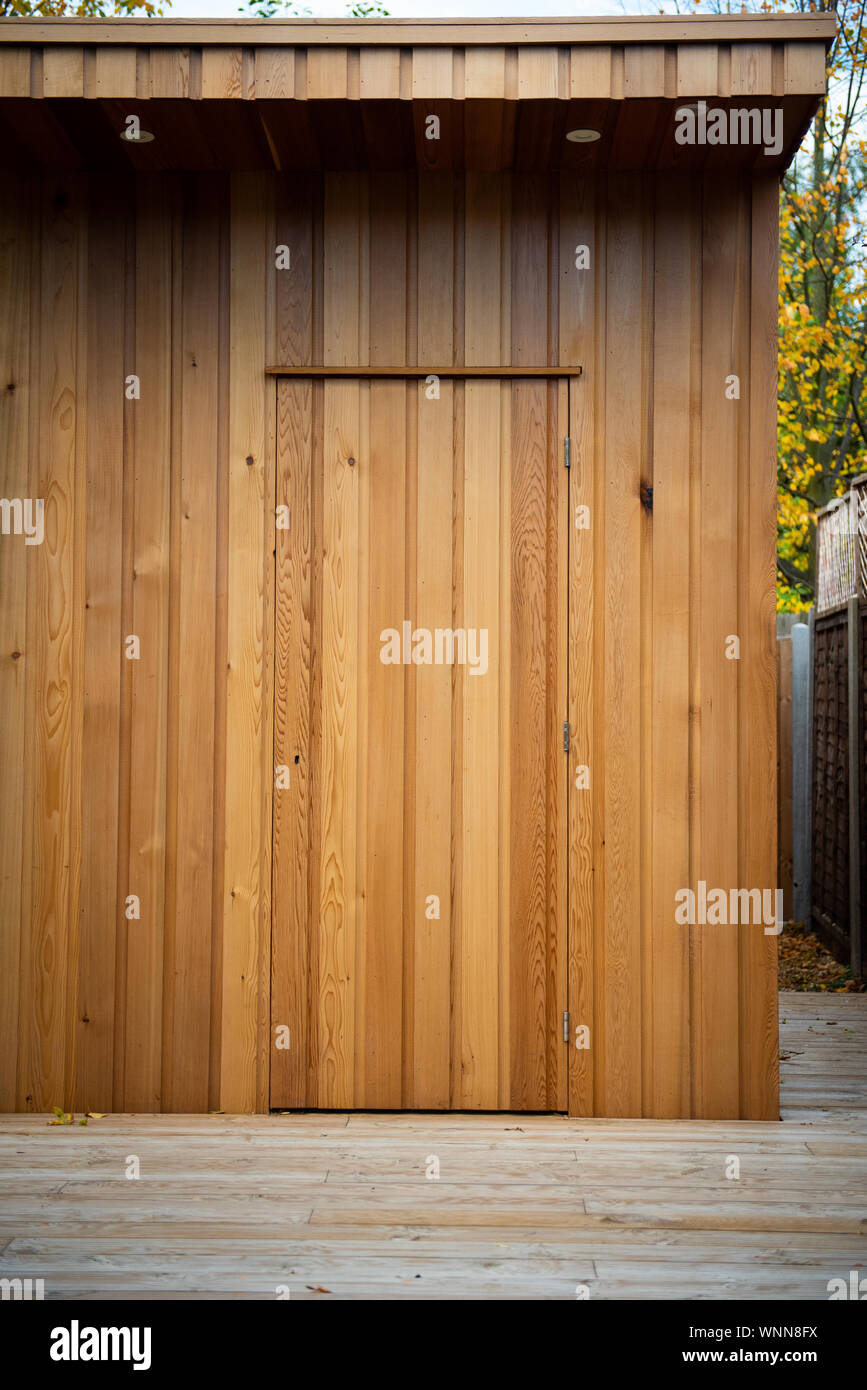 Oiled cedar timber cladding building with secret concealed door Stock ...