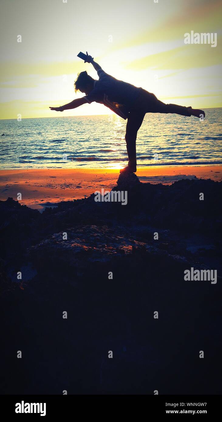 Man balancing on rock hi-res stock photography and images - Alamy