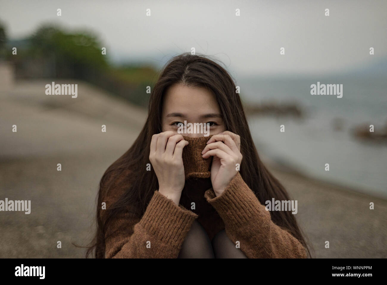 Hiding face hi-res stock photography and images - Alamy