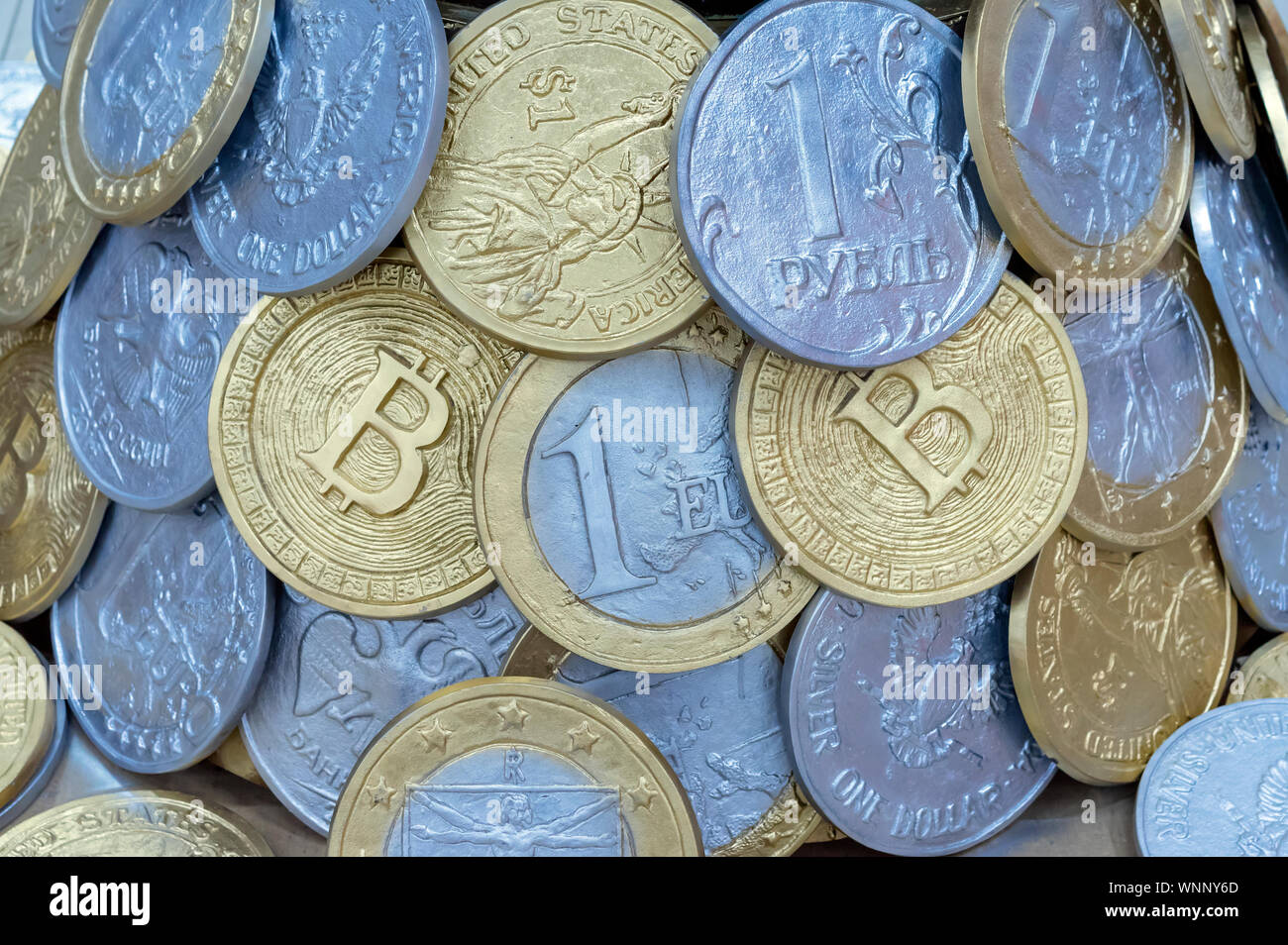 Background from coins of different countries and bitcoins Stock Photo ...