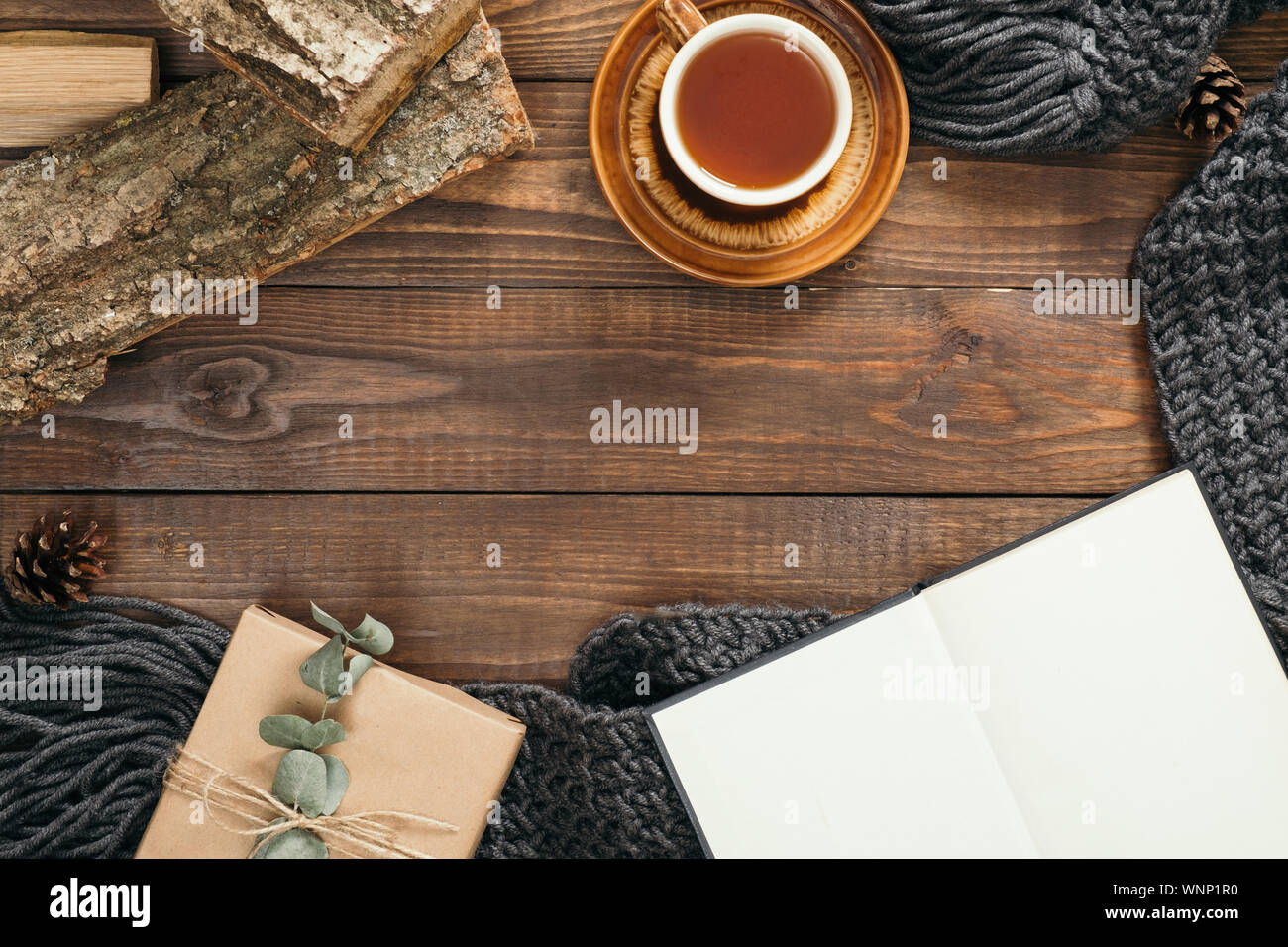 Hygge style flatlay frame with cup of tea, fashion knitted scarf, gift ...