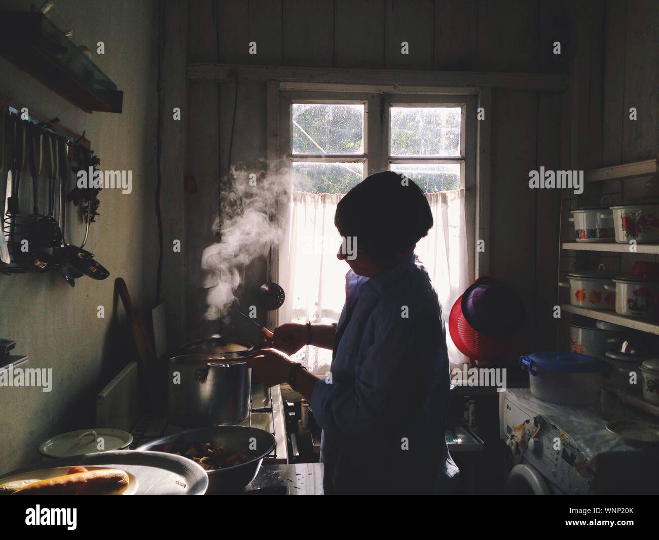 Back View Woman Cooking In High Resolution Stock Photography and Images ...