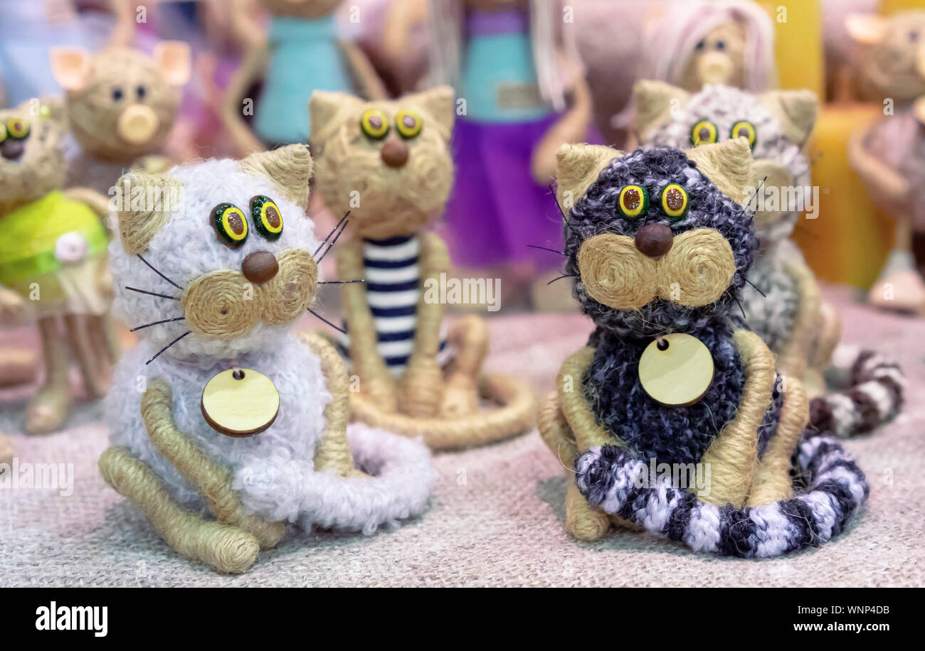 Knitted figures of cats in the gift shop Stock Photo - Alamy