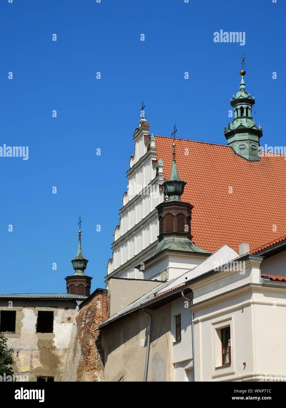 the basilica building towering over the tenement houses in Lublin Stock ...