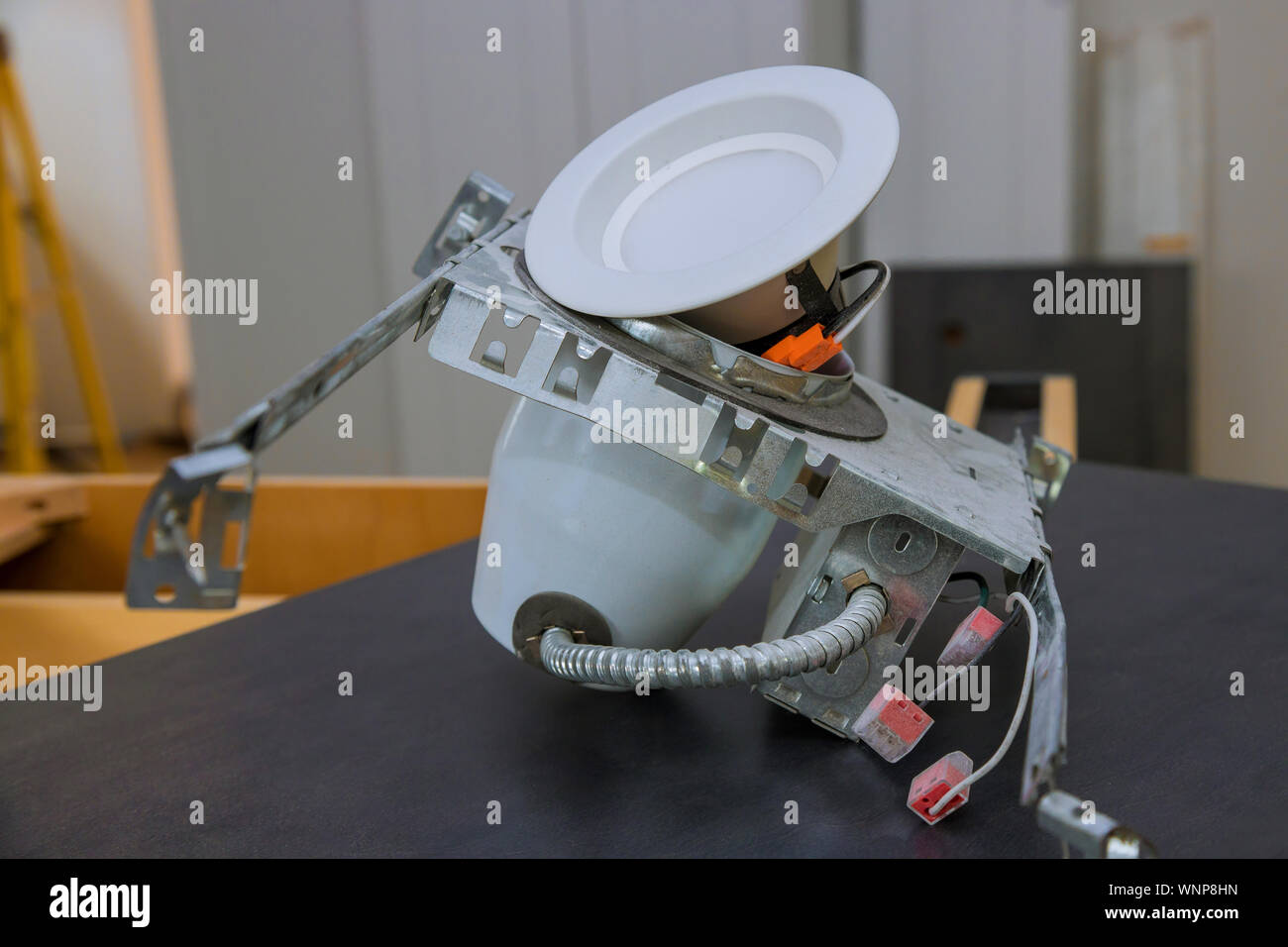 Installing electrical light in the ceiling maintenance replacing repair ...