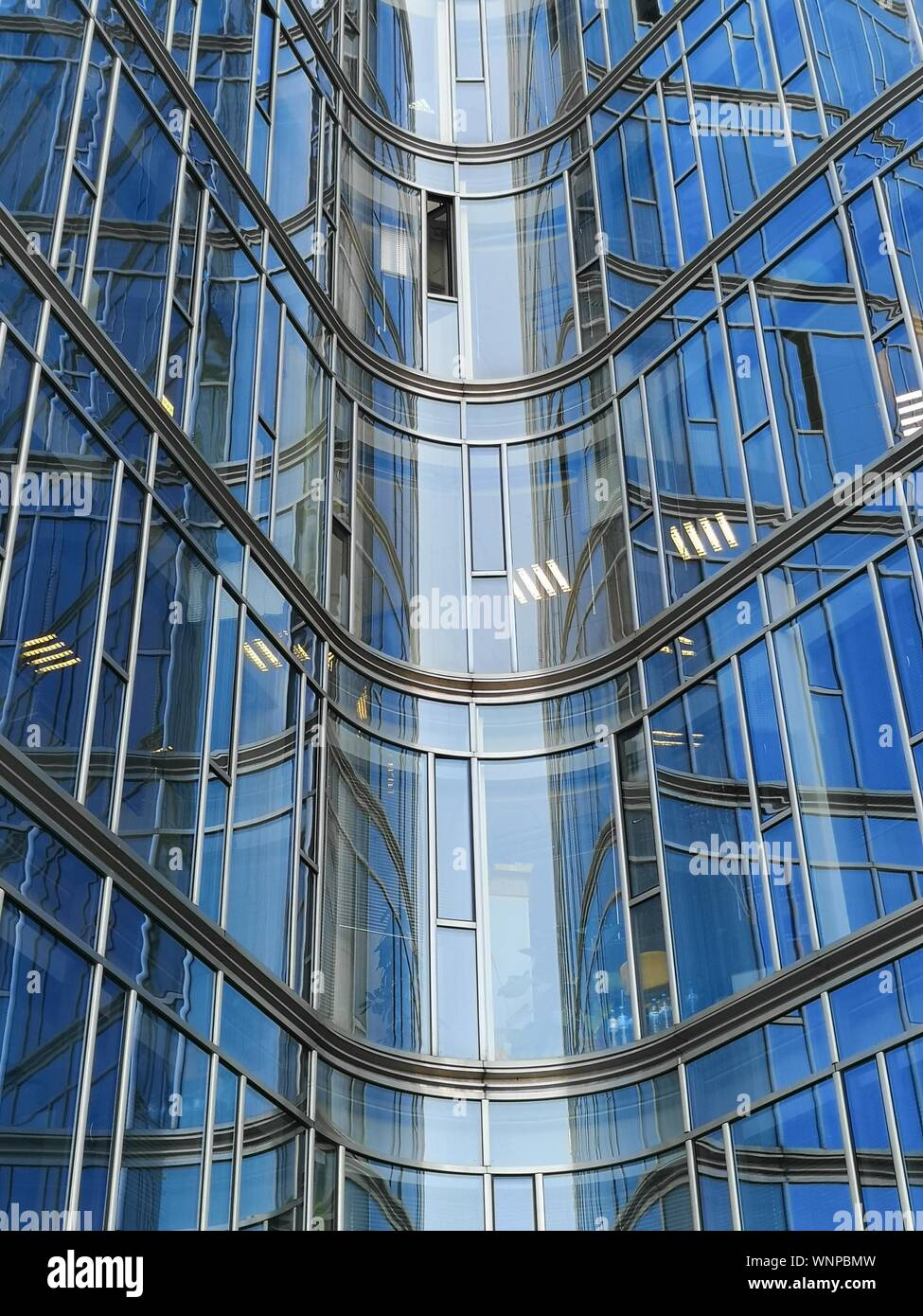 modern looking building with glass walls Stock Photo - Alamy