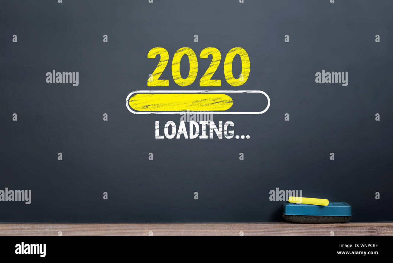 chalks drawing 2020 loading on chalkboard Stock Photo - Alamy