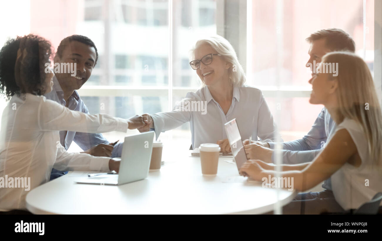 Multiethnic business introduction hi-res stock photography and images ...