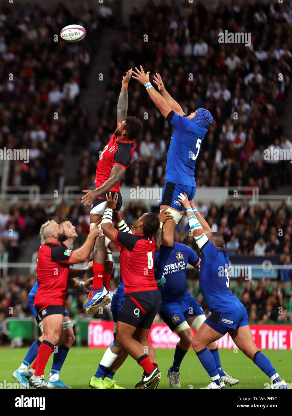 England's Courtney Lawes (left) and Italy's Dean Budd contest a lineout ...