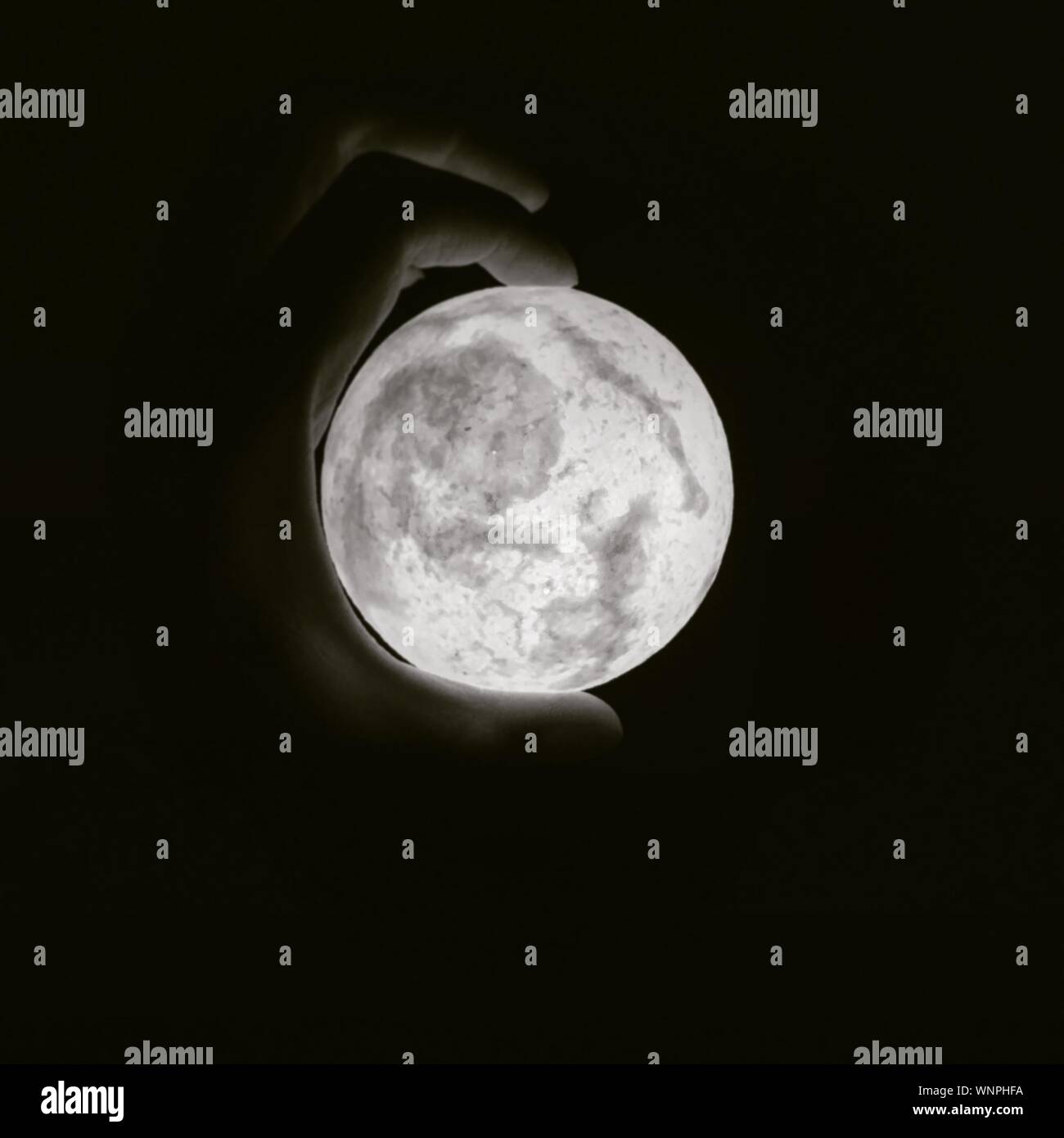 Hand full moon hi-res stock photography and images - Alamy
