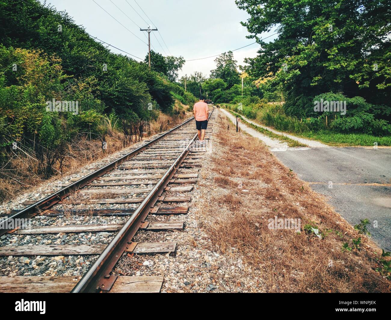 Man Walking On Railway Track High Resolution Stock Photography and ...