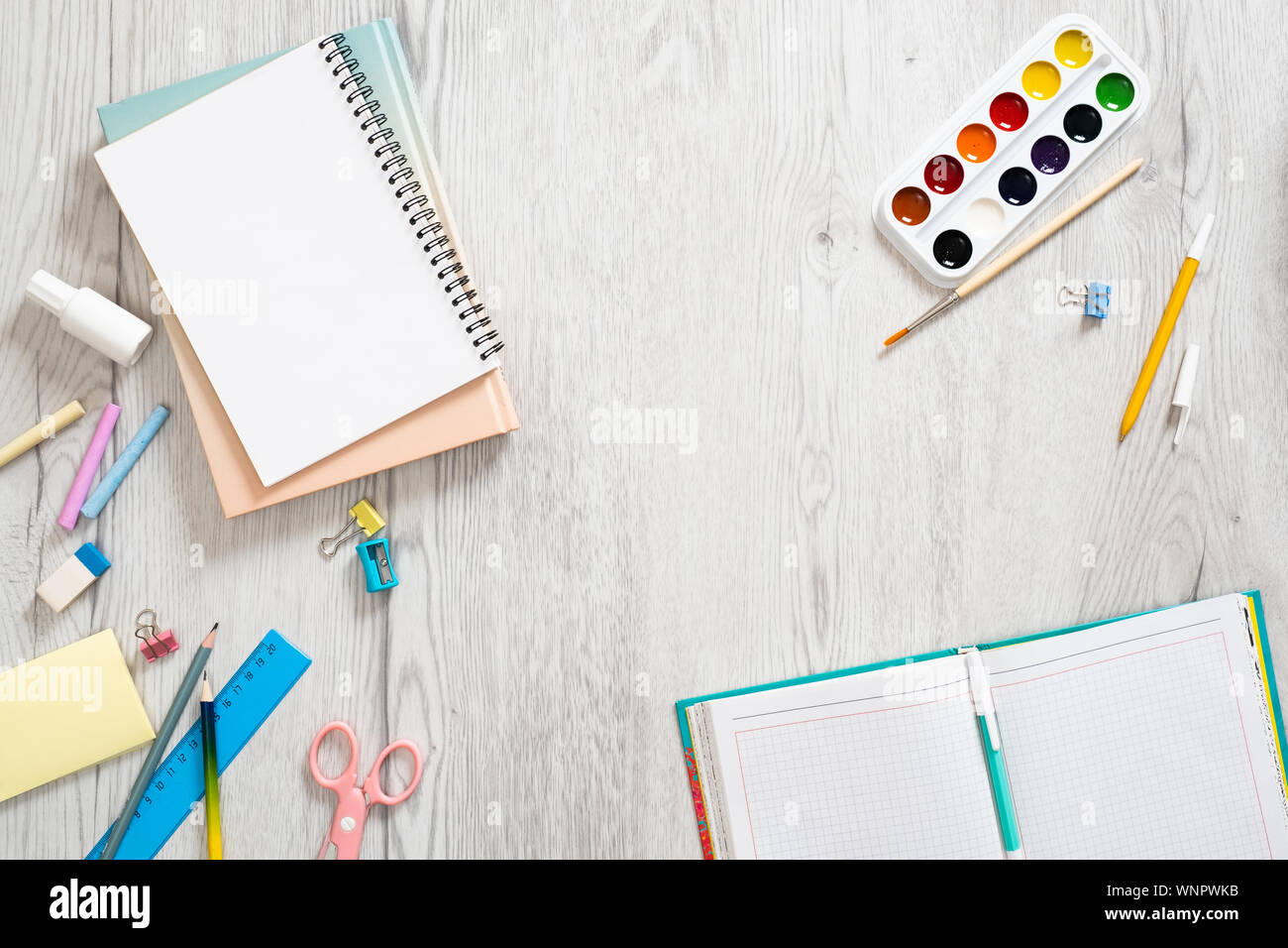 School stationery on wooden background. Flat lay, top view. Back to ...