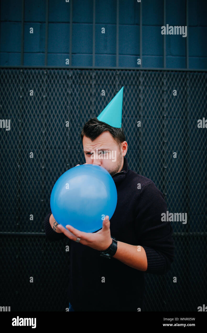 Blowing Balloon Man High Resolution Stock Photography and Images - Alamy