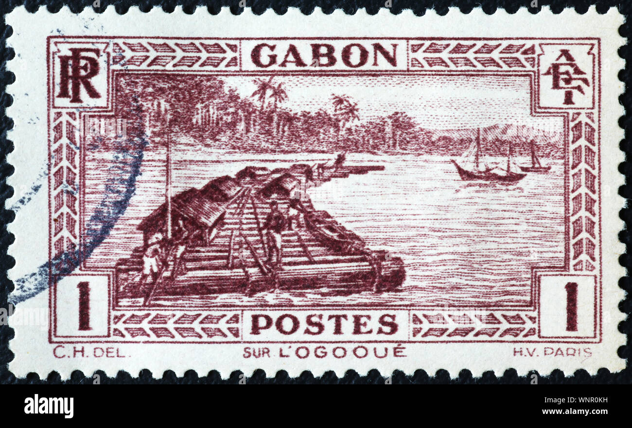 Log raft on old postage stamp of Gabon Stock Photo - Alamy