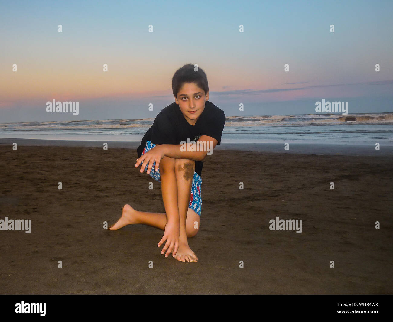 Kneeling boy hi-res stock photography and images - Alamy