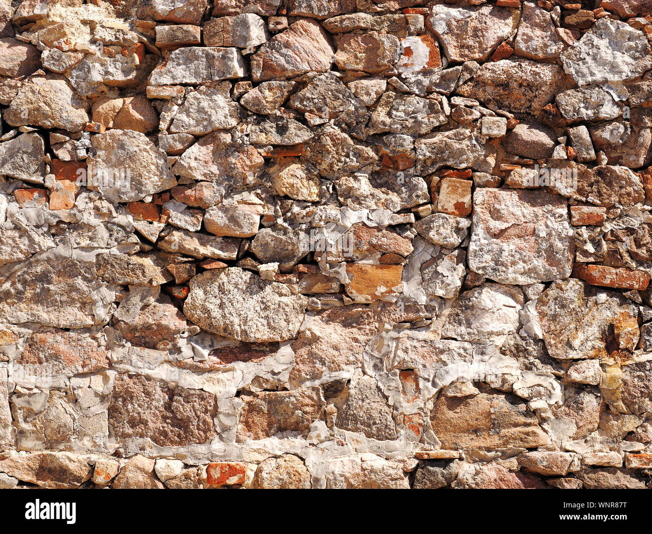 Rough wall made of natural stone and boulders Stock Photo - Alamy