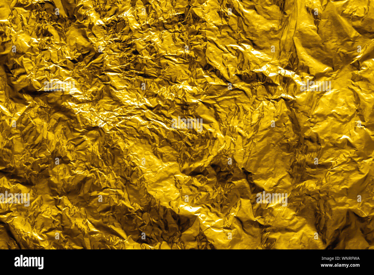 Wrinkled gold foil hi-res stock photography and images - Alamy