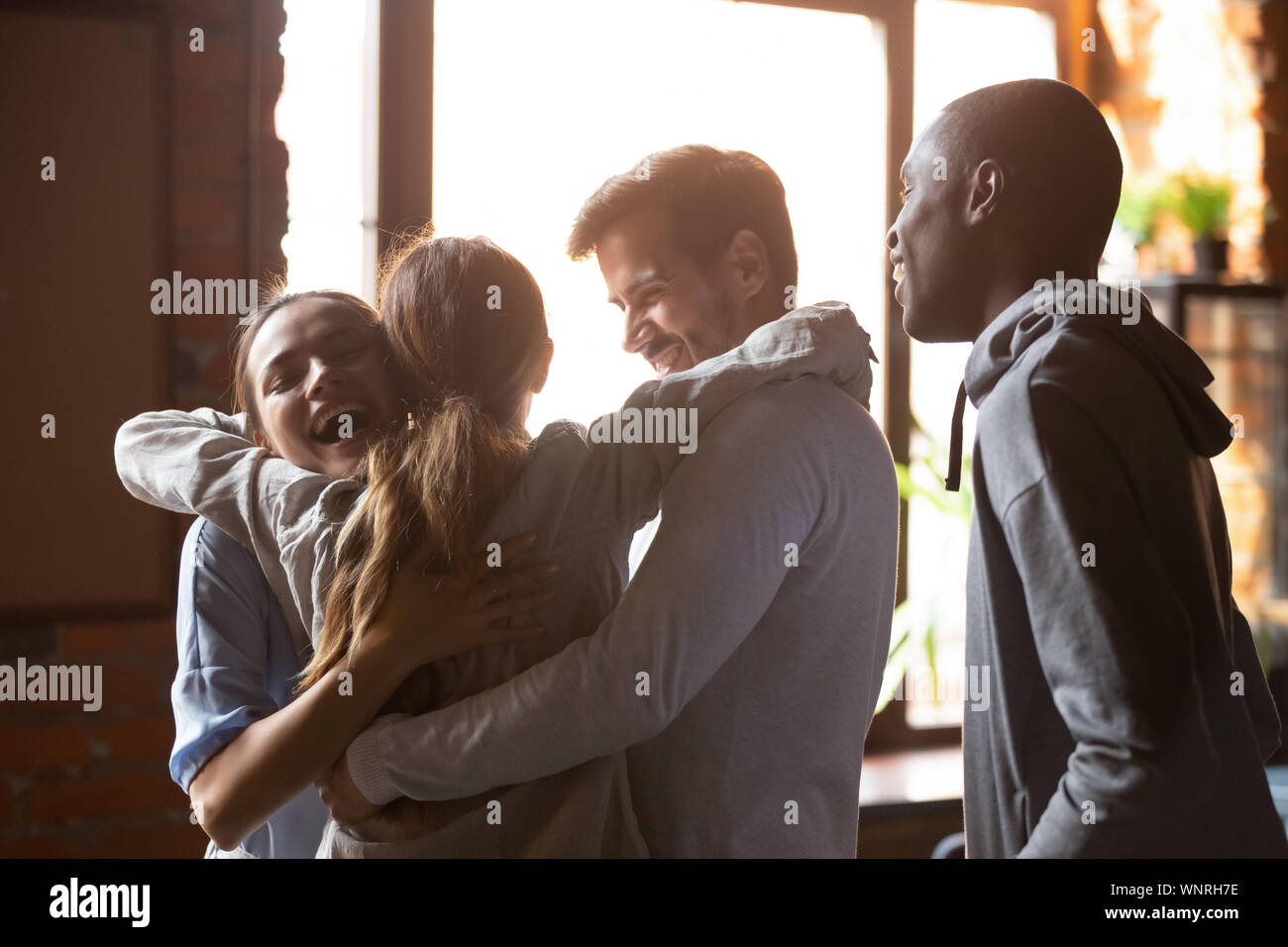 Greeting friends cafe hi-res stock photography and images - Alamy