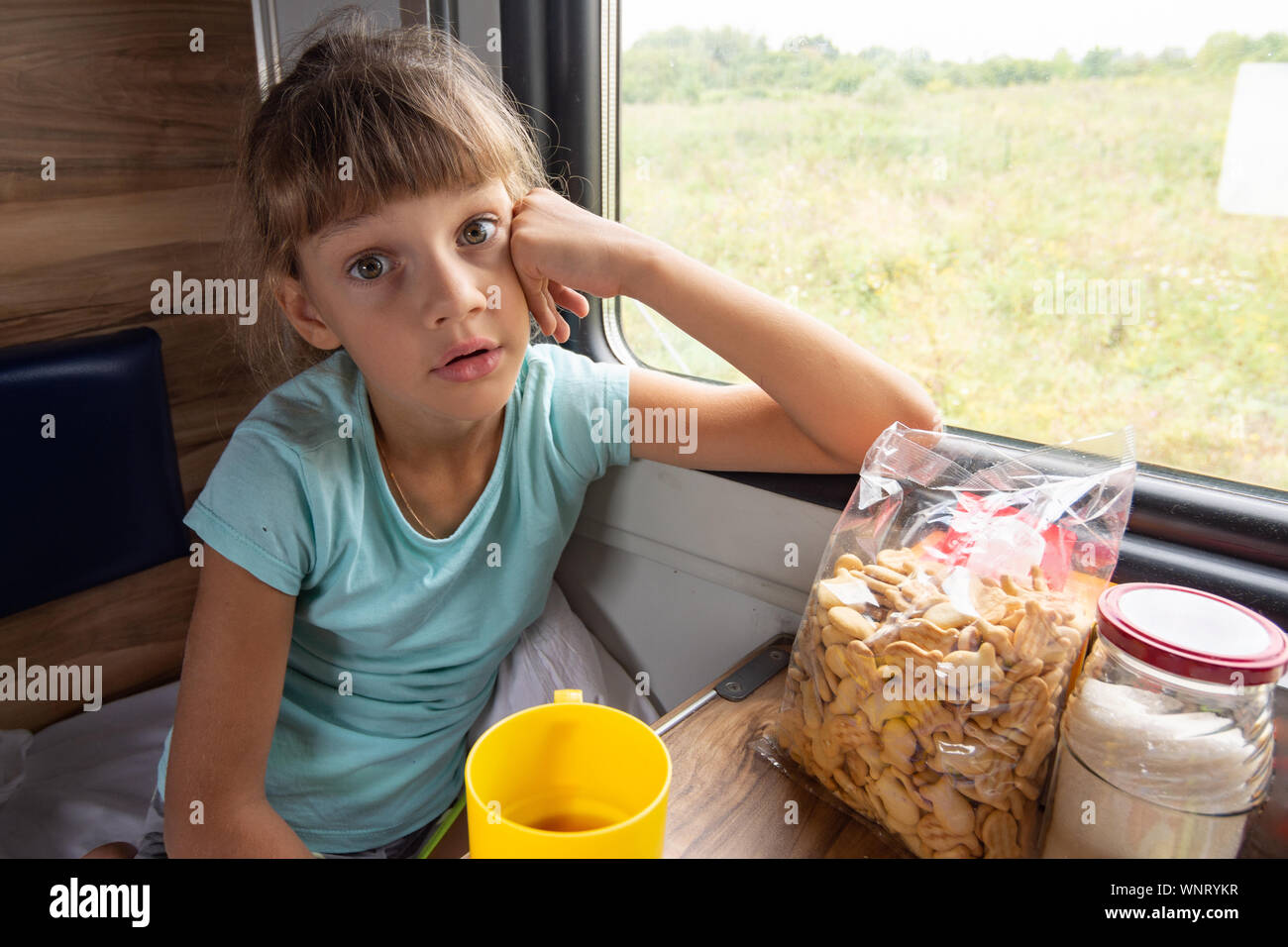 Girl sitting in a reserved seat carriage in a train funny looks in the ...