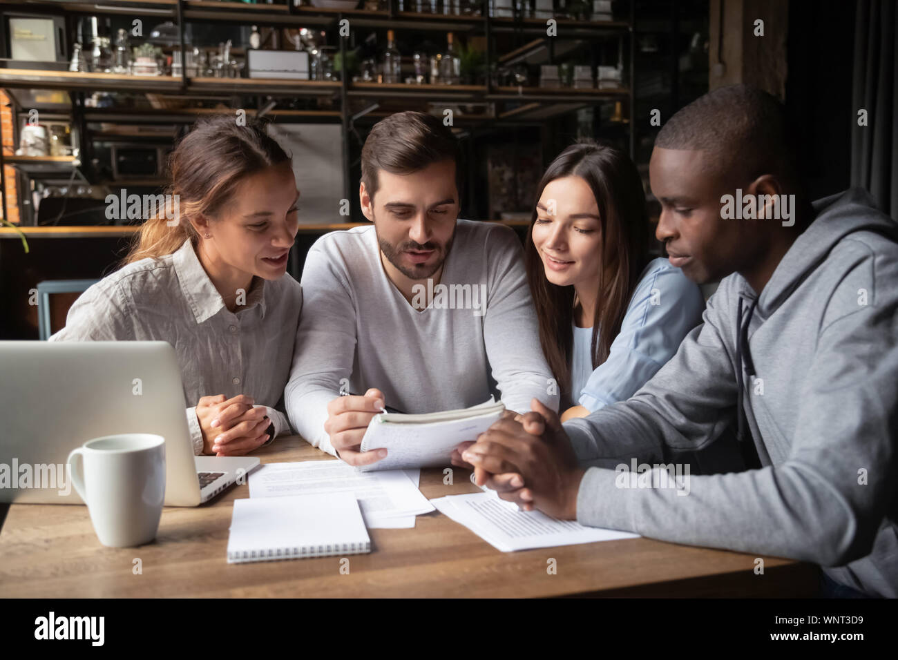 Doing homework with friends hi-res stock photography and images - Alamy