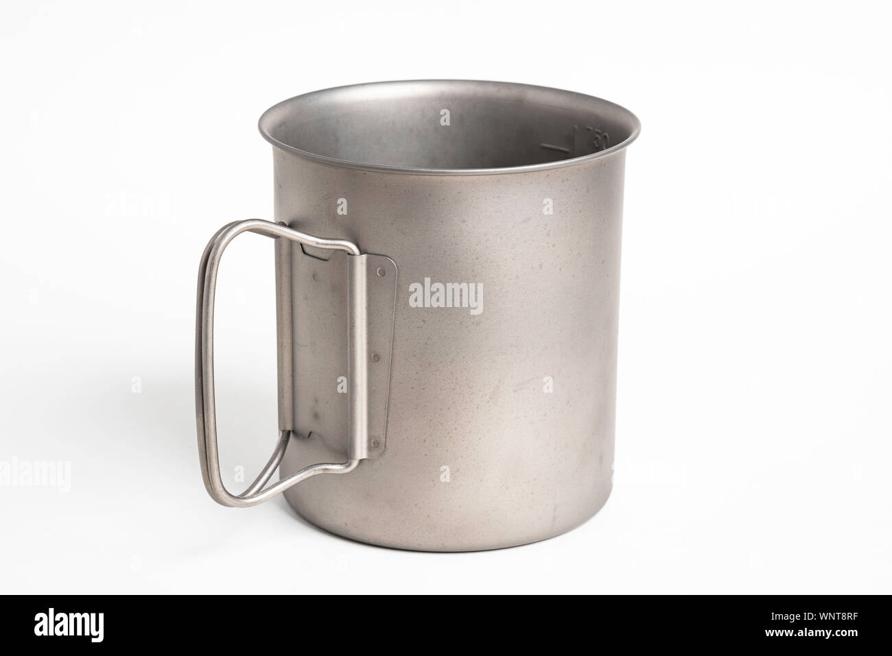 An all-metal multiple purpose mug with flexible handle and measuring ...