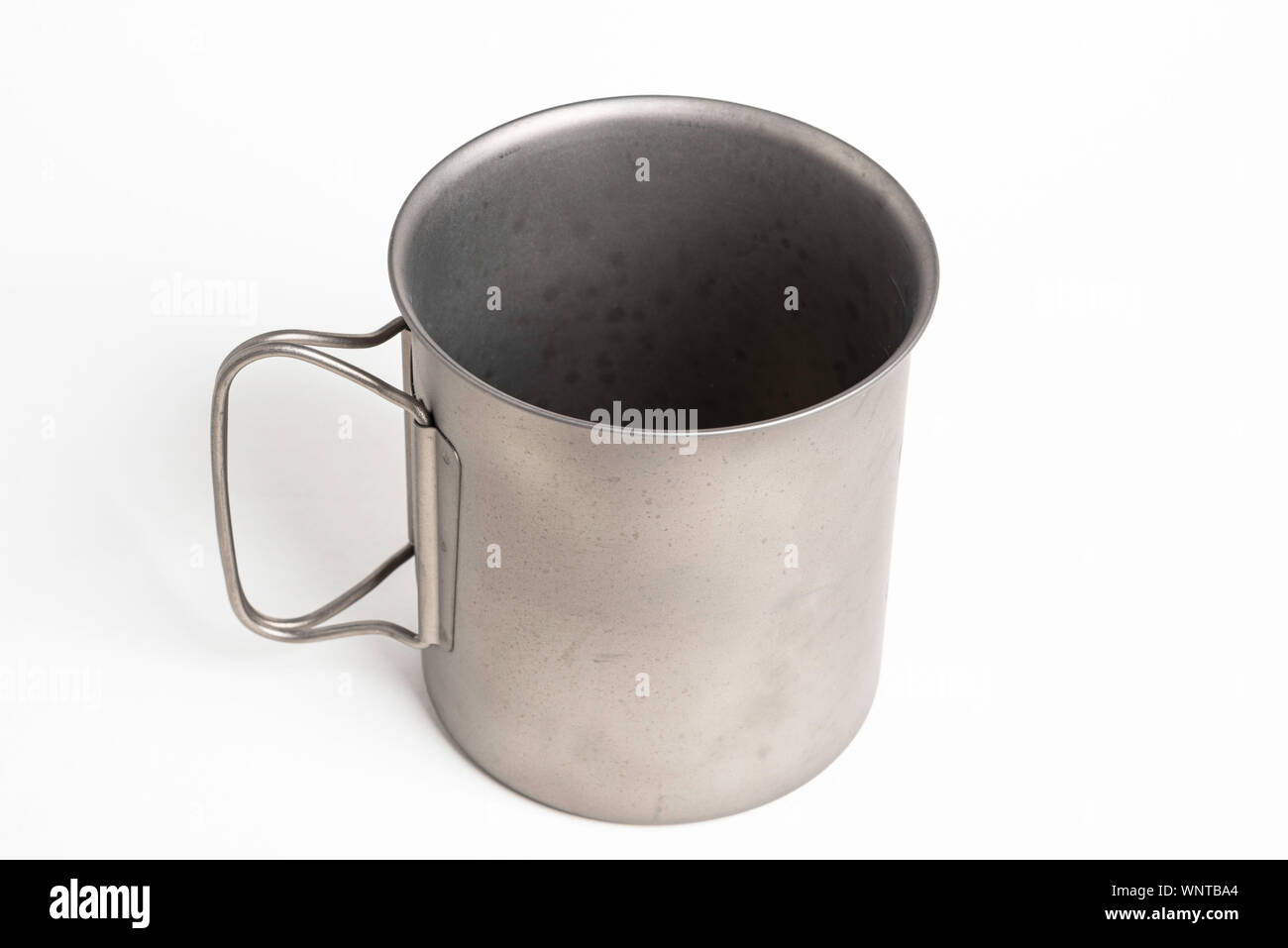 An all-metal multiple purpose mug with flexible handle and measuring ...