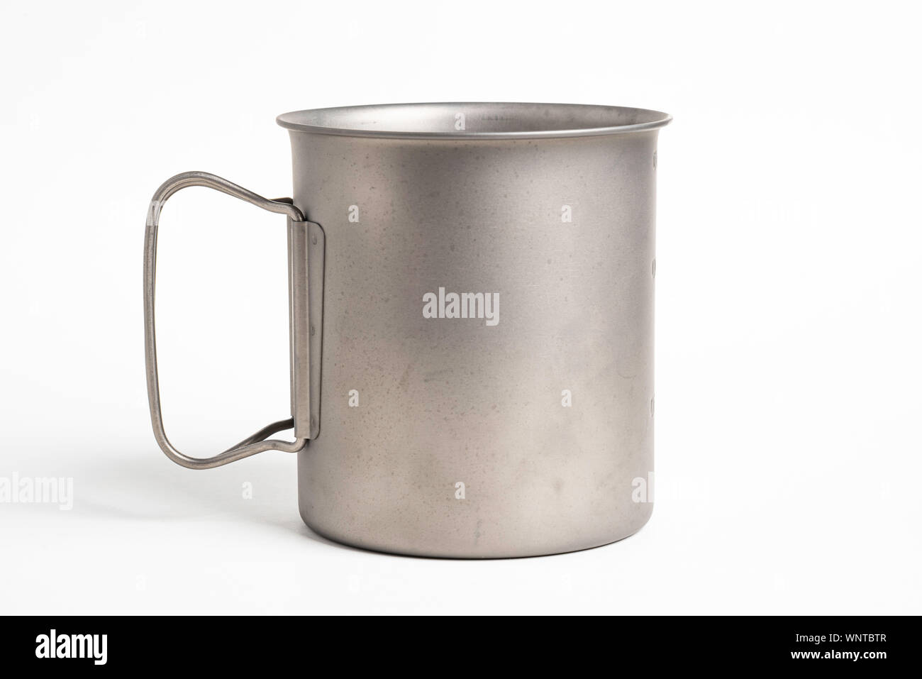 An all-metal multiple purpose mug with flexible handle and measuring ...