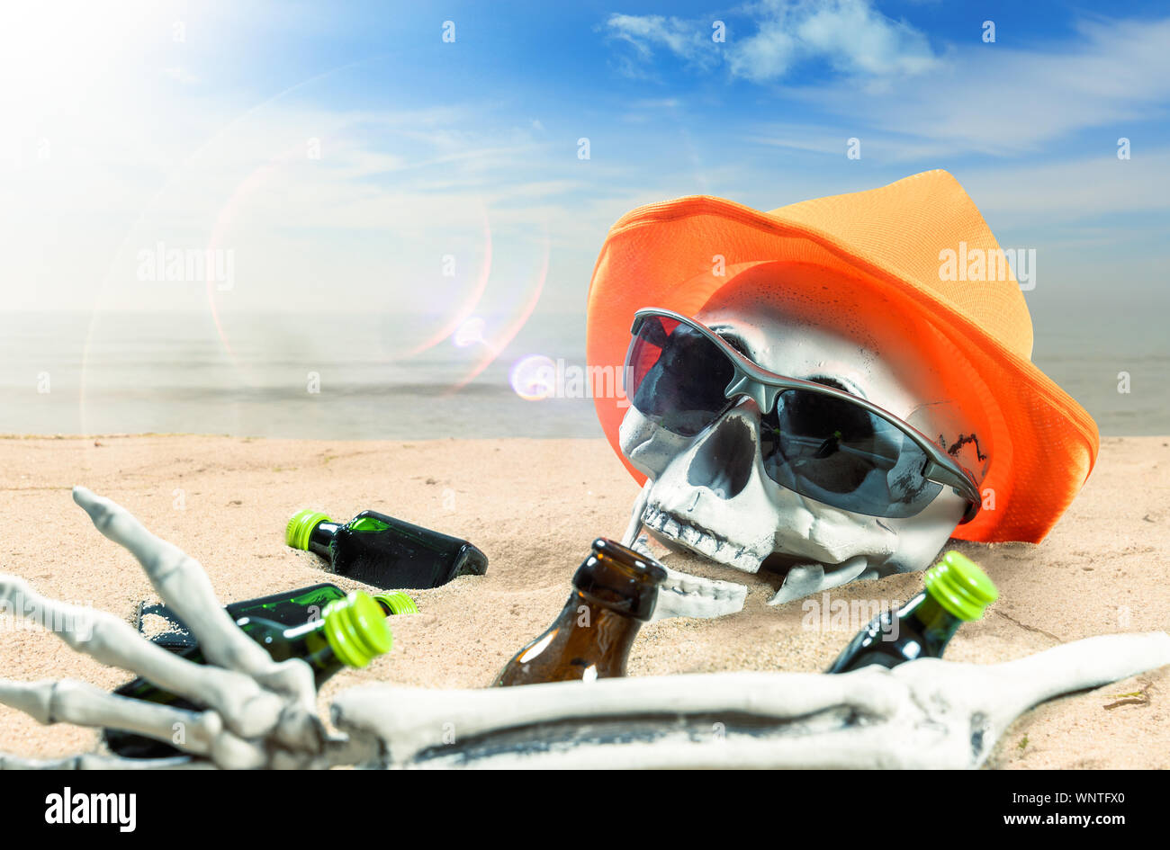 skeleton of a celebrating person died of too much alcohol on a lonely ...