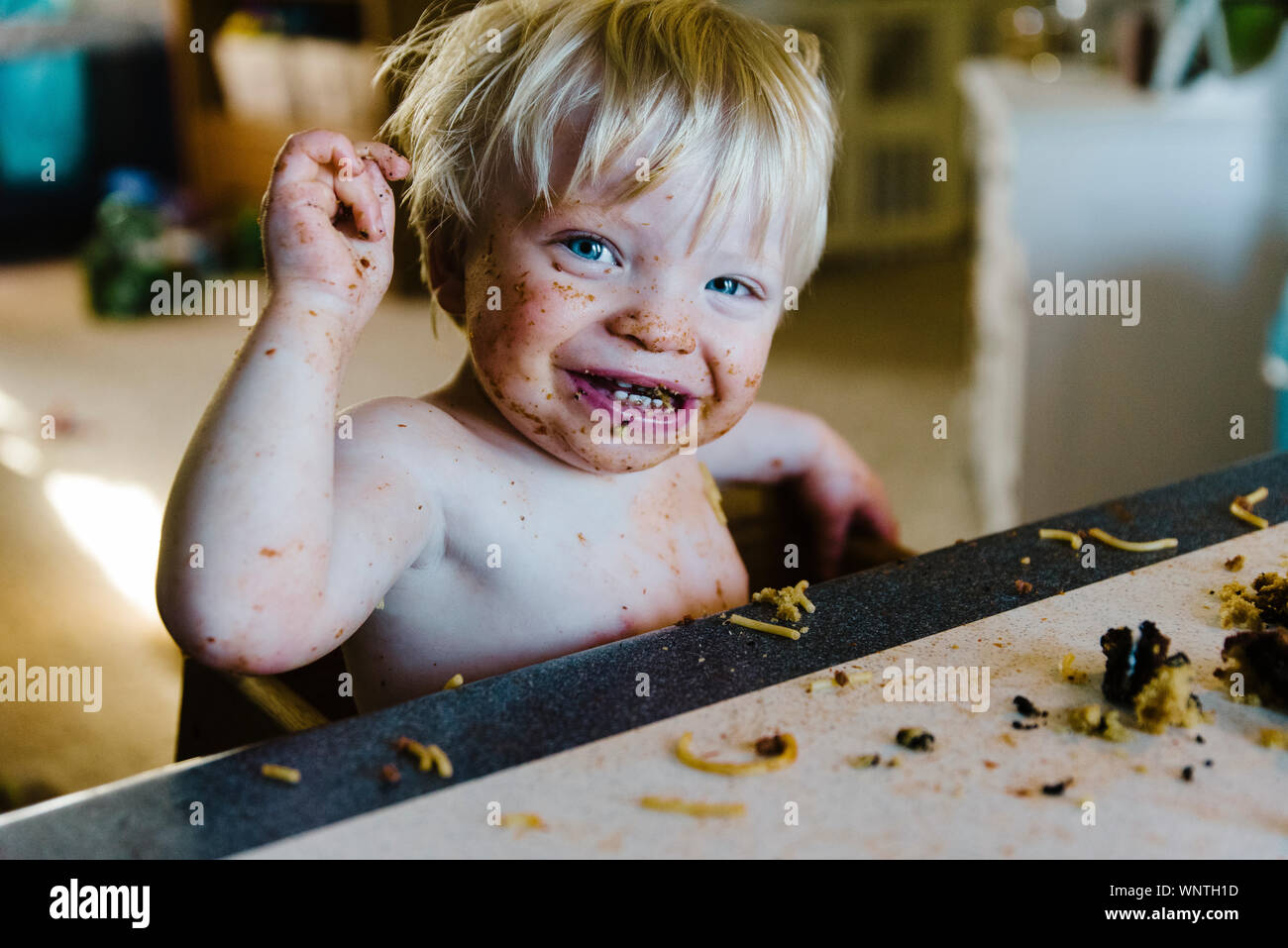 Toddler spaghetti mess at the table Stock Photo - Alamy