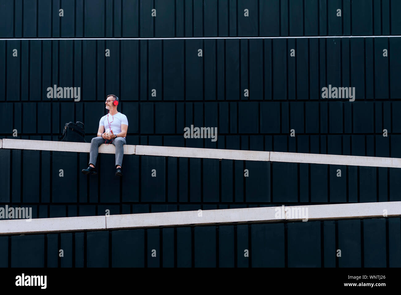 Businessman looking around wall hi-res stock photography and images - Alamy